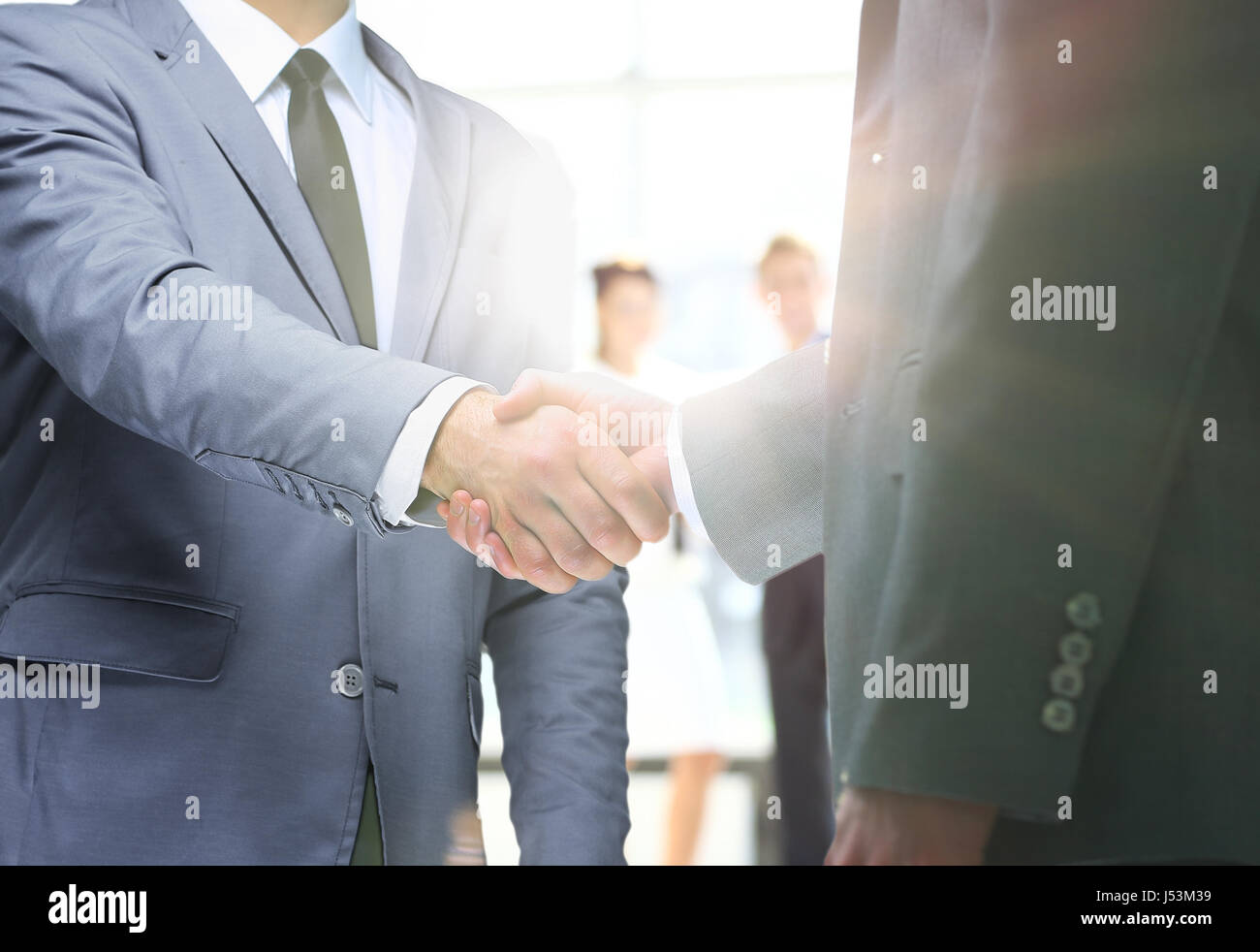 Business partners shaking hands Stock Photo - Alamy