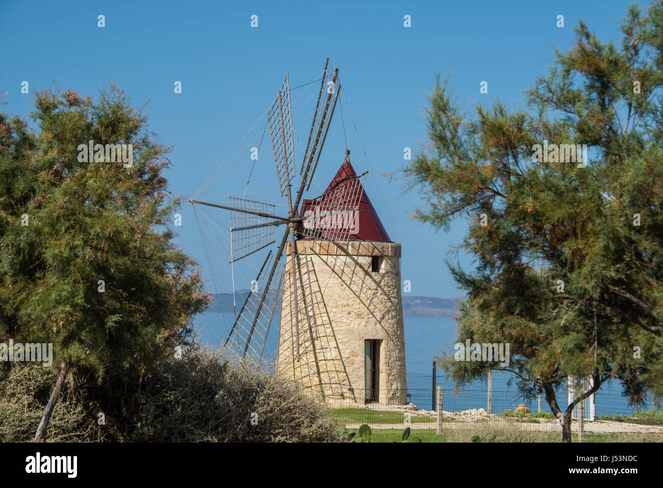 A windmill on Erice beach near Nino Castiglione Gardens, Sicily Stock ...