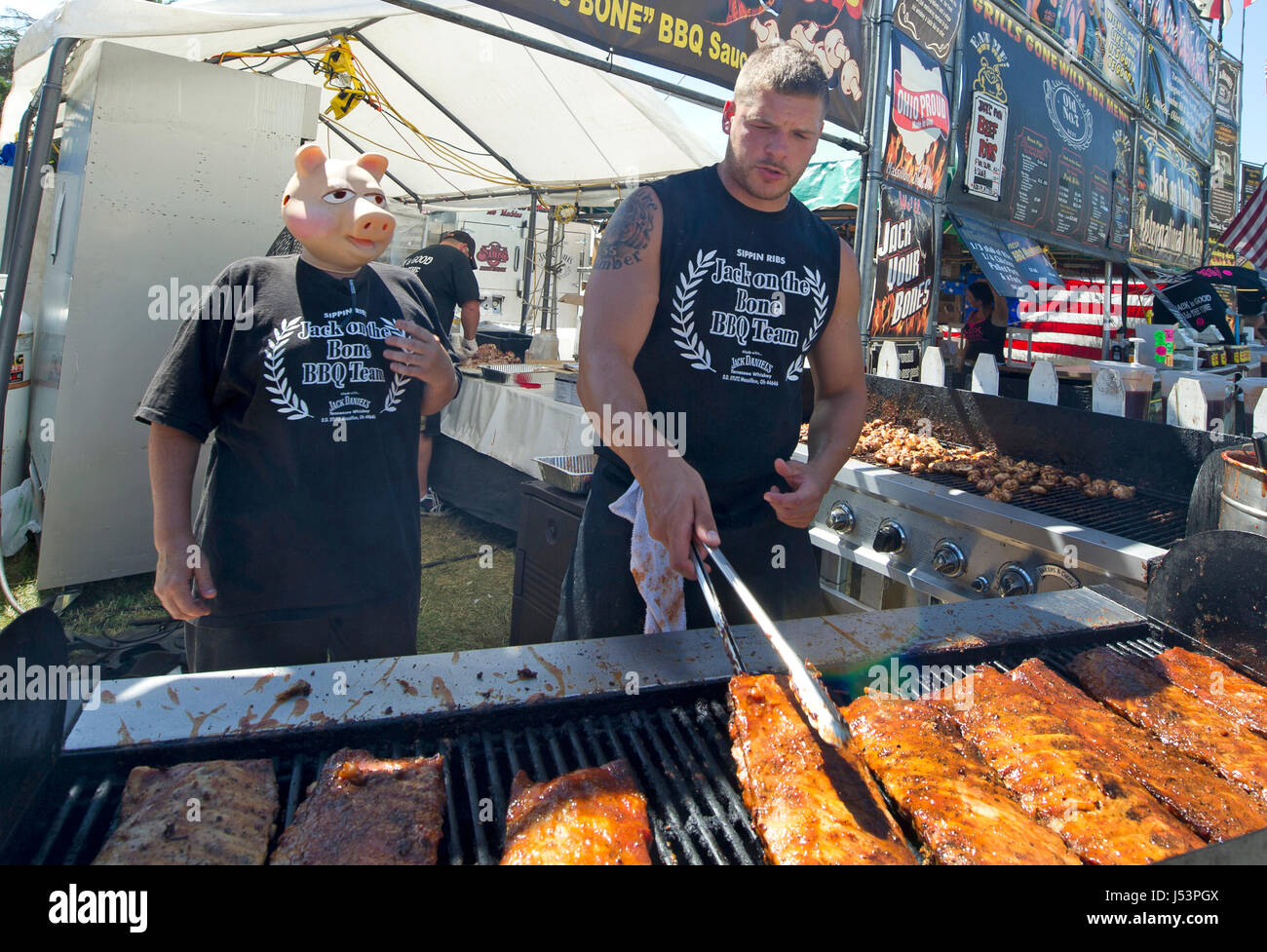 Jack on the Bone BBQ team grilling pork ribs during Toronto ribfest ...