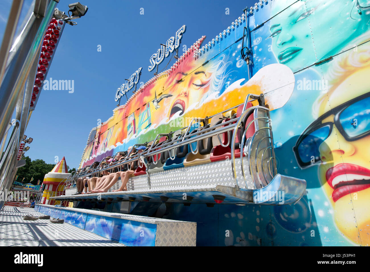 Children enjoying a thrill ride at a funfair in Centennial Park in ...