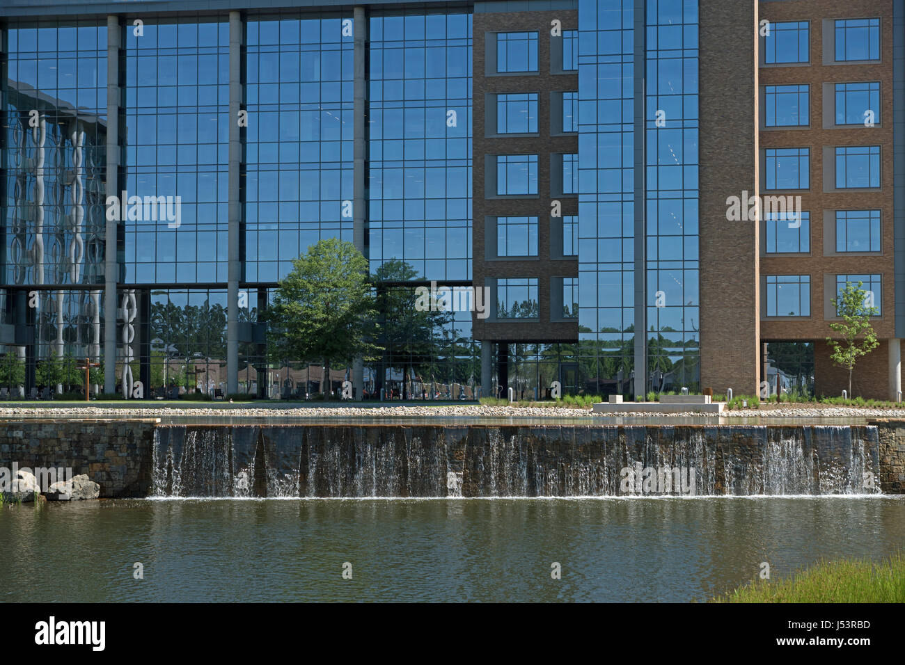 Tall building with glass windows Stock Photo - Alamy