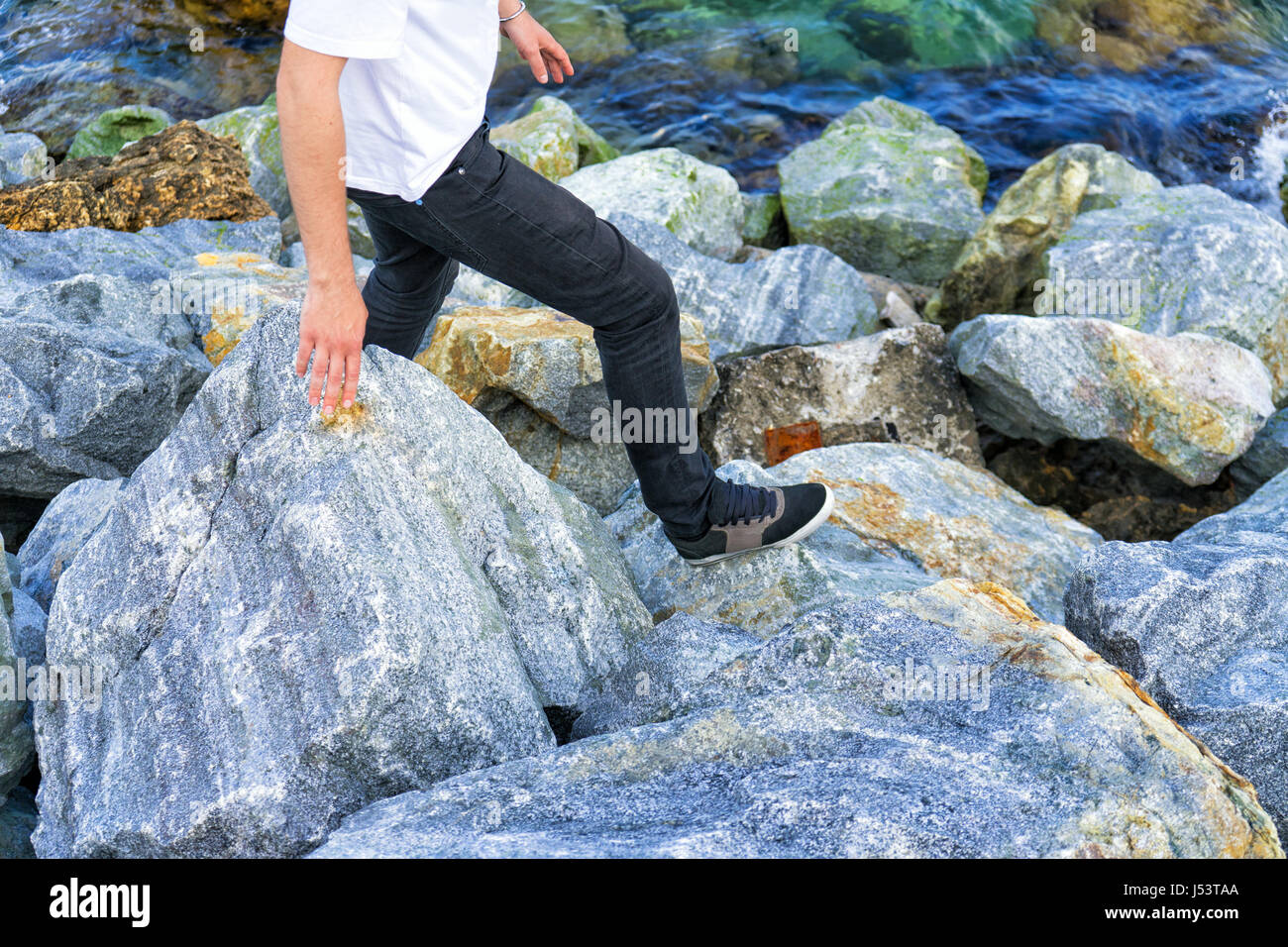 man hiker legs standing on mountain stone peak rock Stock Photo - Alamy