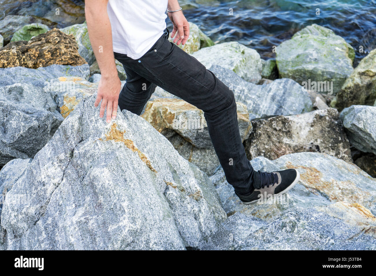 man hiker legs standing on mountain stone peak rock Stock Photo - Alamy
