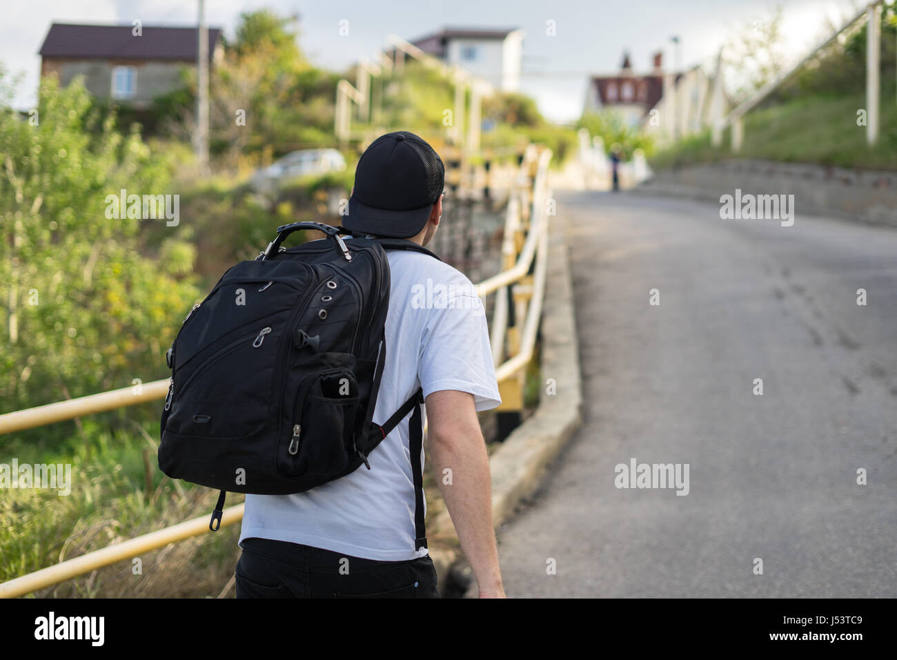 Back view of man with backpack hi-res stock photography and images - Alamy