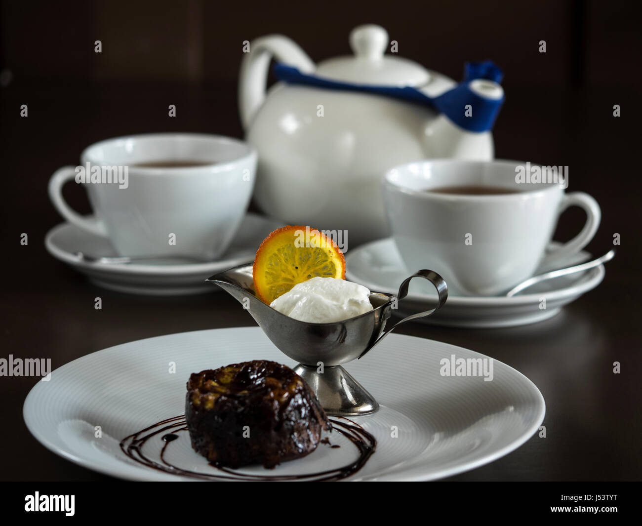 Chocolate fondant with cream Stock Photo - Alamy