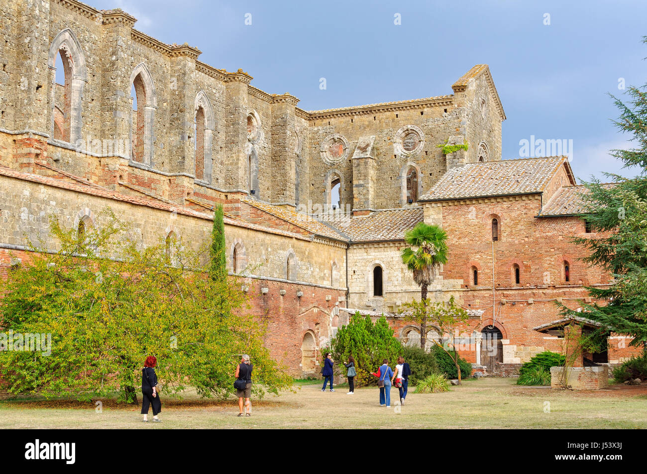 Tourists admire the abbey of Saint Galgano, a former Cistercian ...