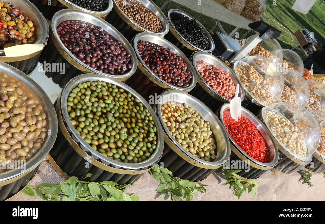 market stall with products of the Mediterranean areas with ripe olives ...