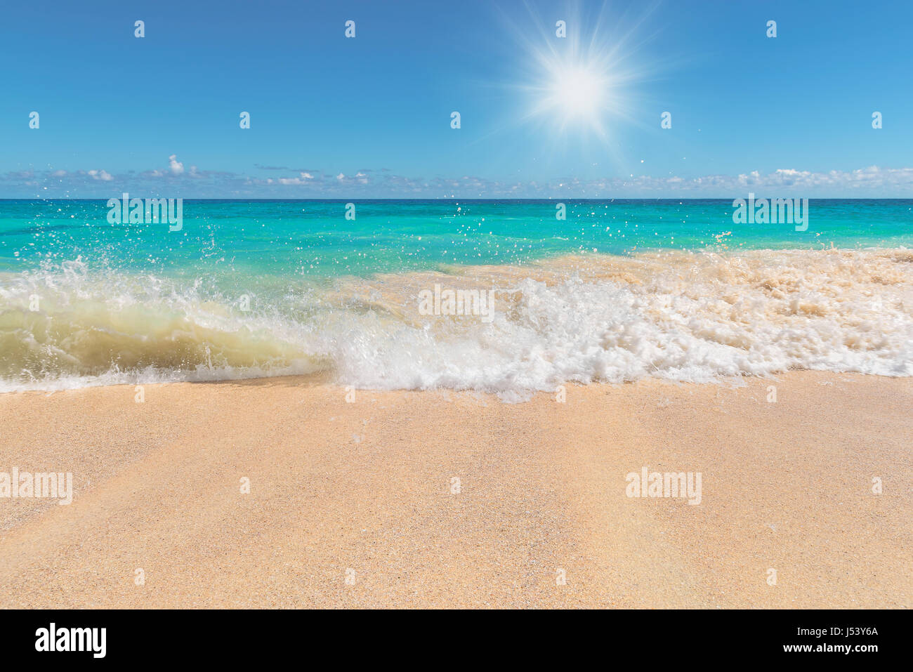 Beach, wave and sunshine Stock Photo - Alamy