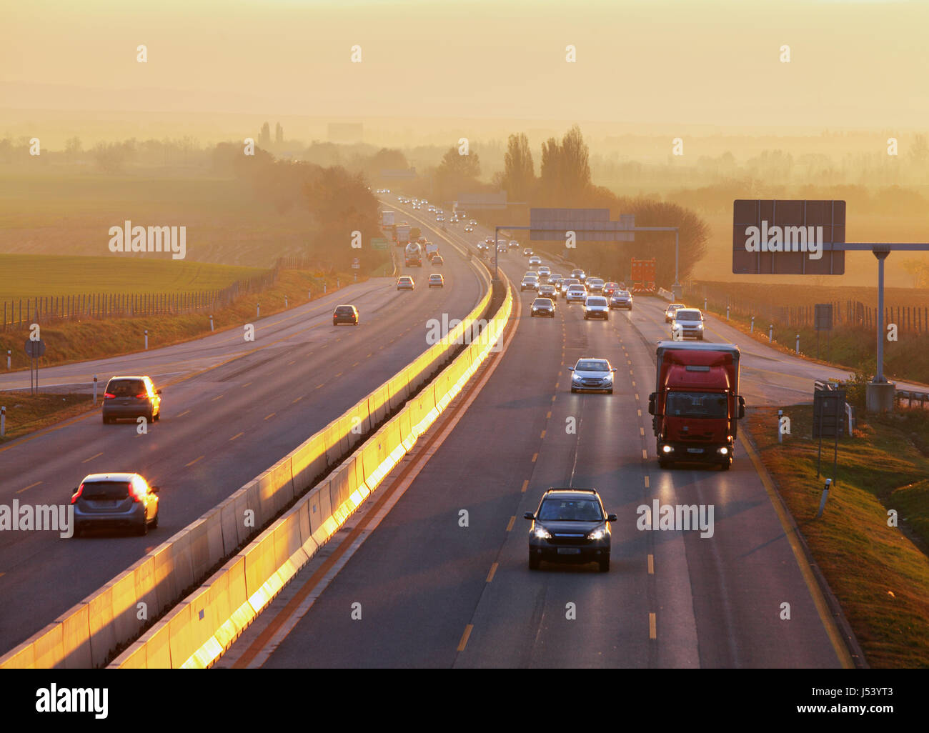 Car traffic against the sunset background Stock Photo - Alamy