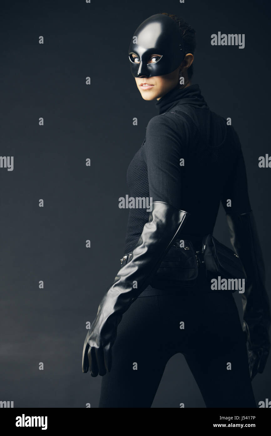 Female thief in black mask Stock Photo - Alamy
