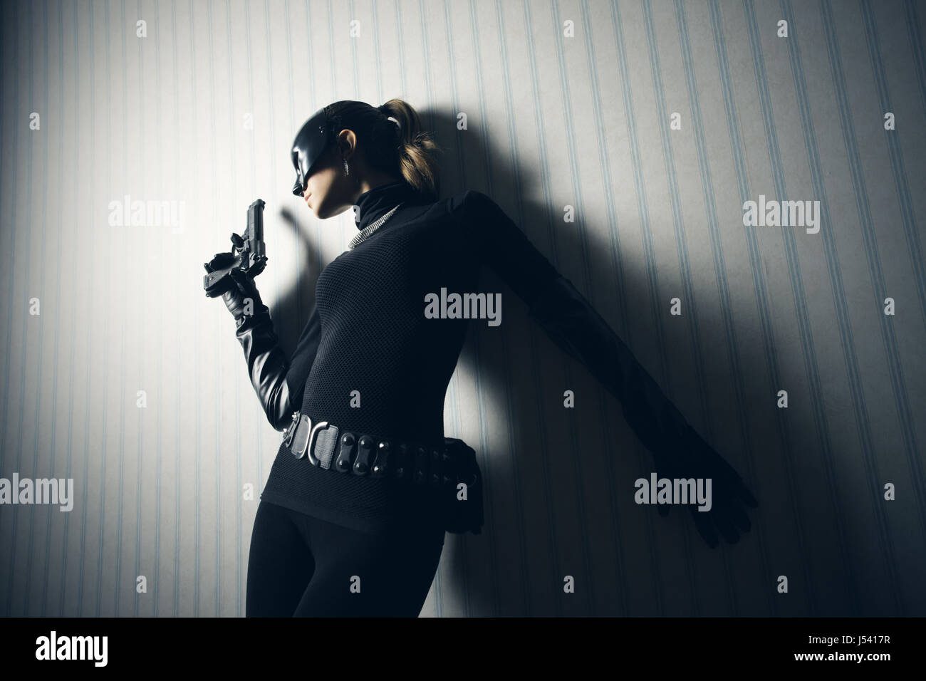 Female thief in black mask hi-res stock photography and images - Alamy