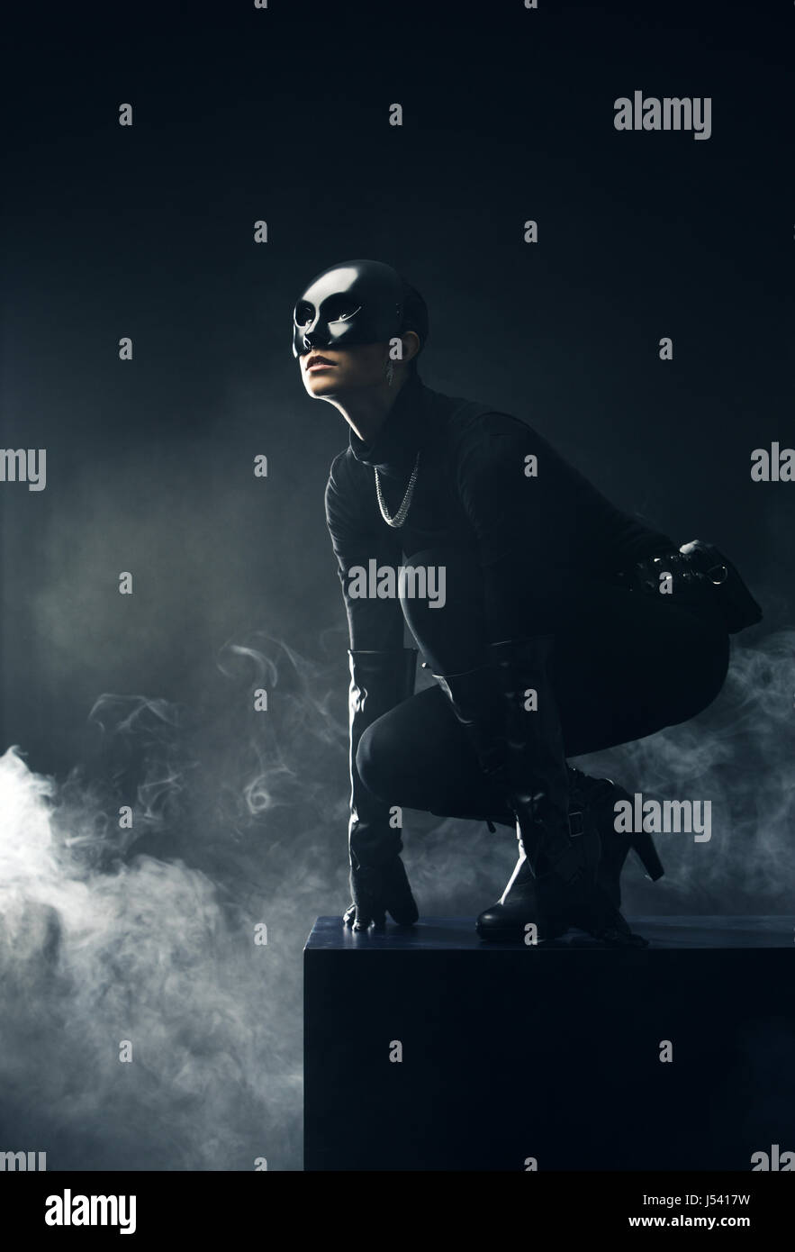 Female thief in black mask Stock Photo - Alamy