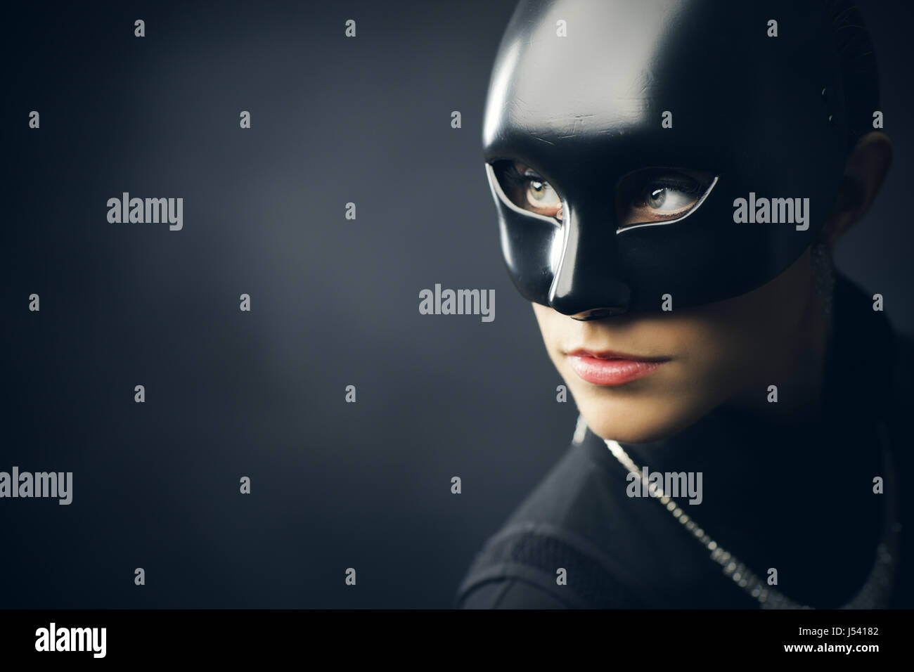 Portrait of female thief in black mask Stock Photo - Alamy