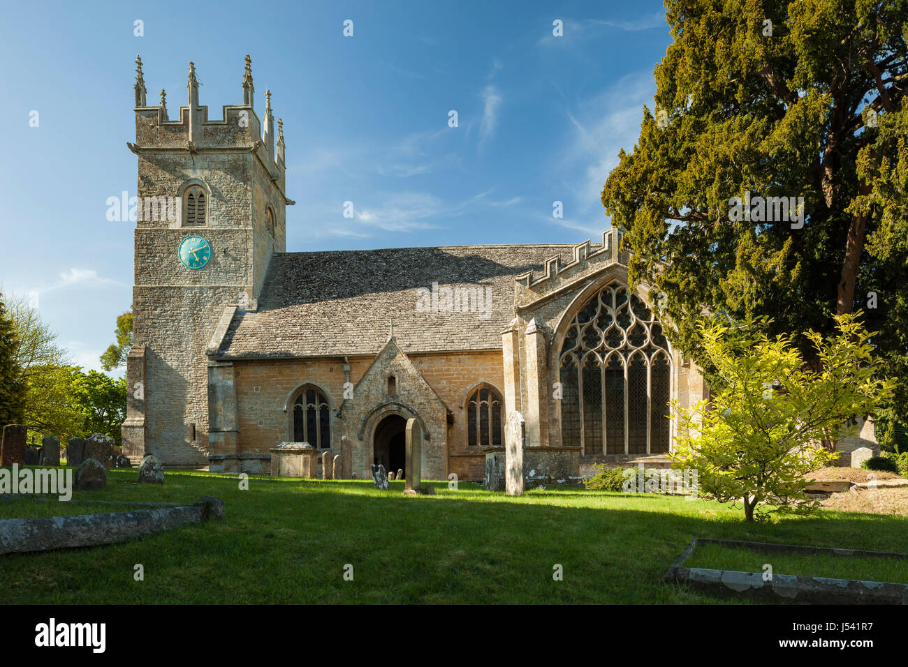 Spring afternoon at St James church in the Cotswolds village of ...