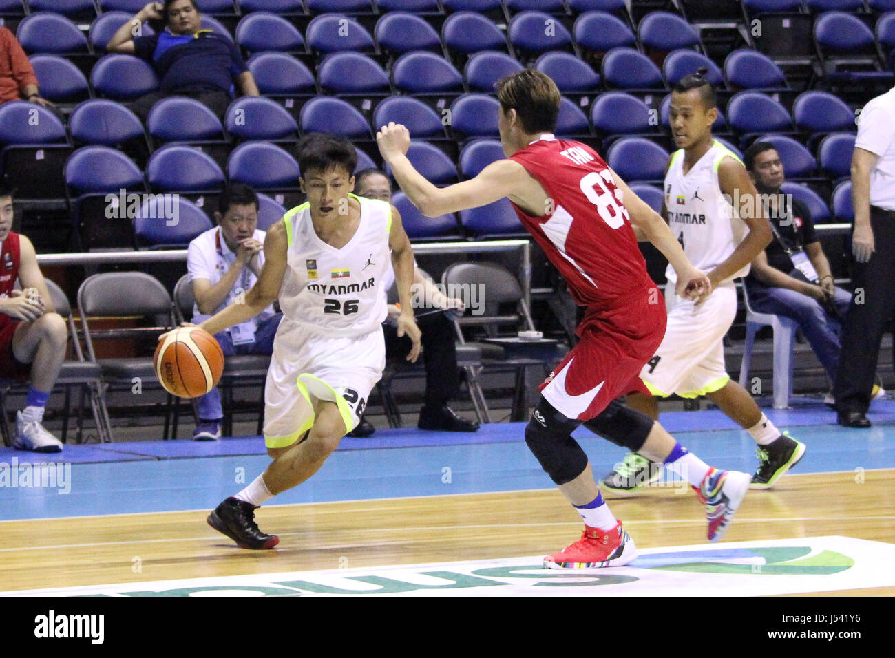 Tin Min Mon (26) of Myanmar drives past guard Tan Chin Hong (83) of ...