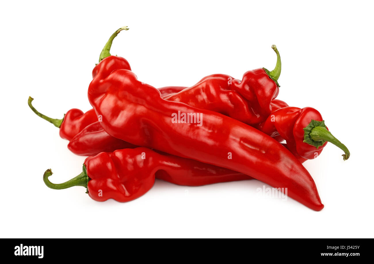 Group of several whole fresh red sweet paprika peppers isolated on ...