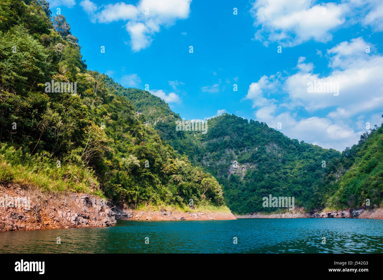 Beautiful reservoir scenery with blue sky in summer Stock Photo - Alamy