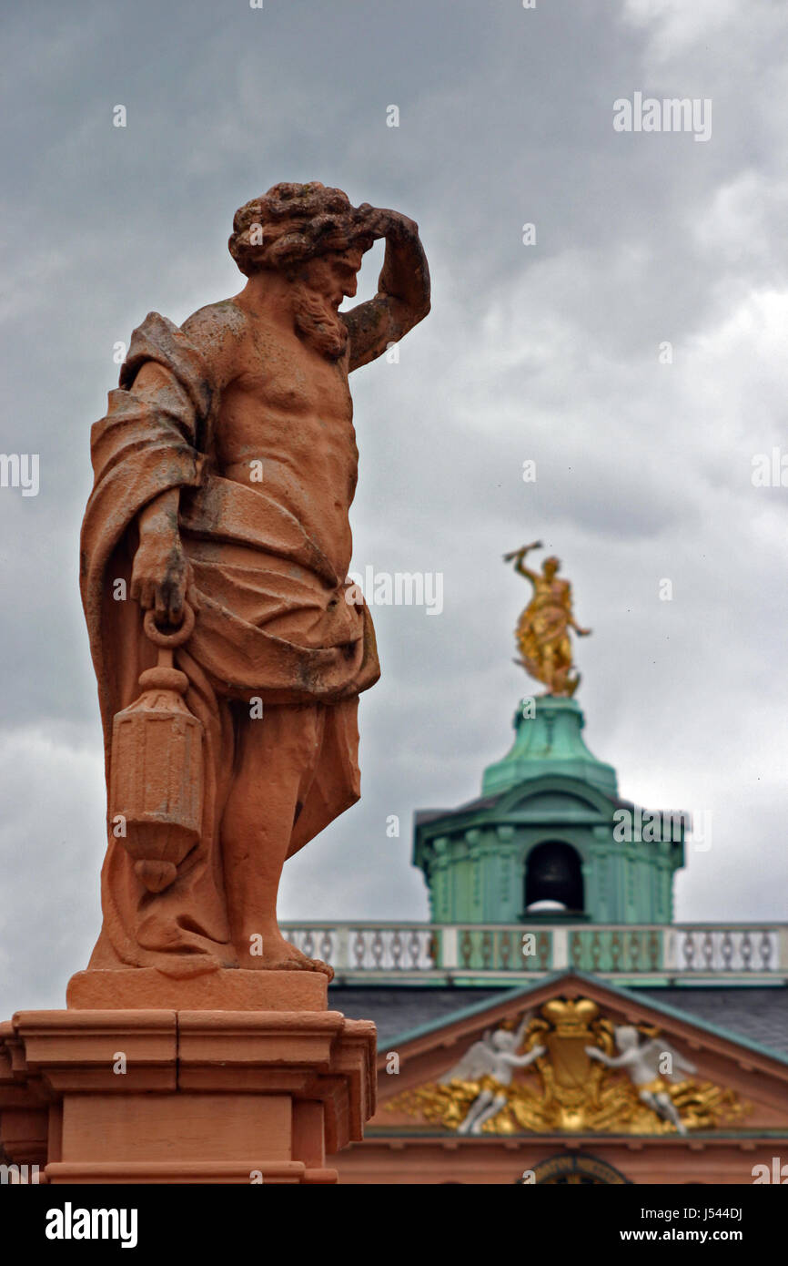 statue overlooking castle Stock Photo - Alamy