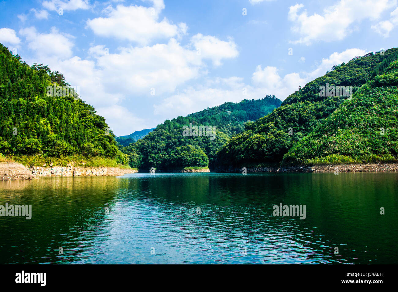 Beautiful reservoir scenery with blue sky in summer Stock Photo - Alamy
