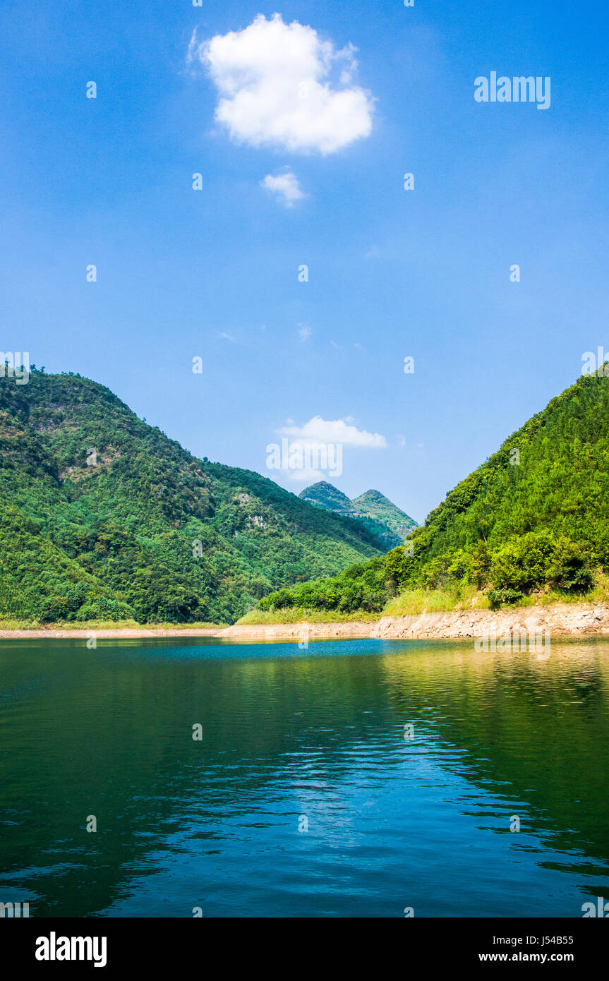 Beautiful reservoir scenery with blue sky in summer Stock Photo - Alamy