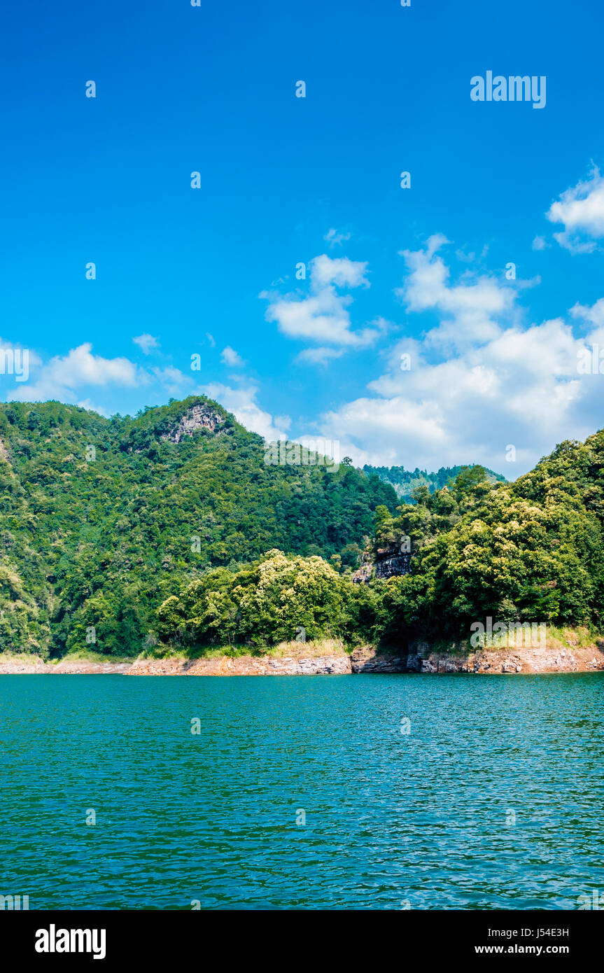 Beautiful reservoir scenery with blue sky in summer Stock Photo - Alamy