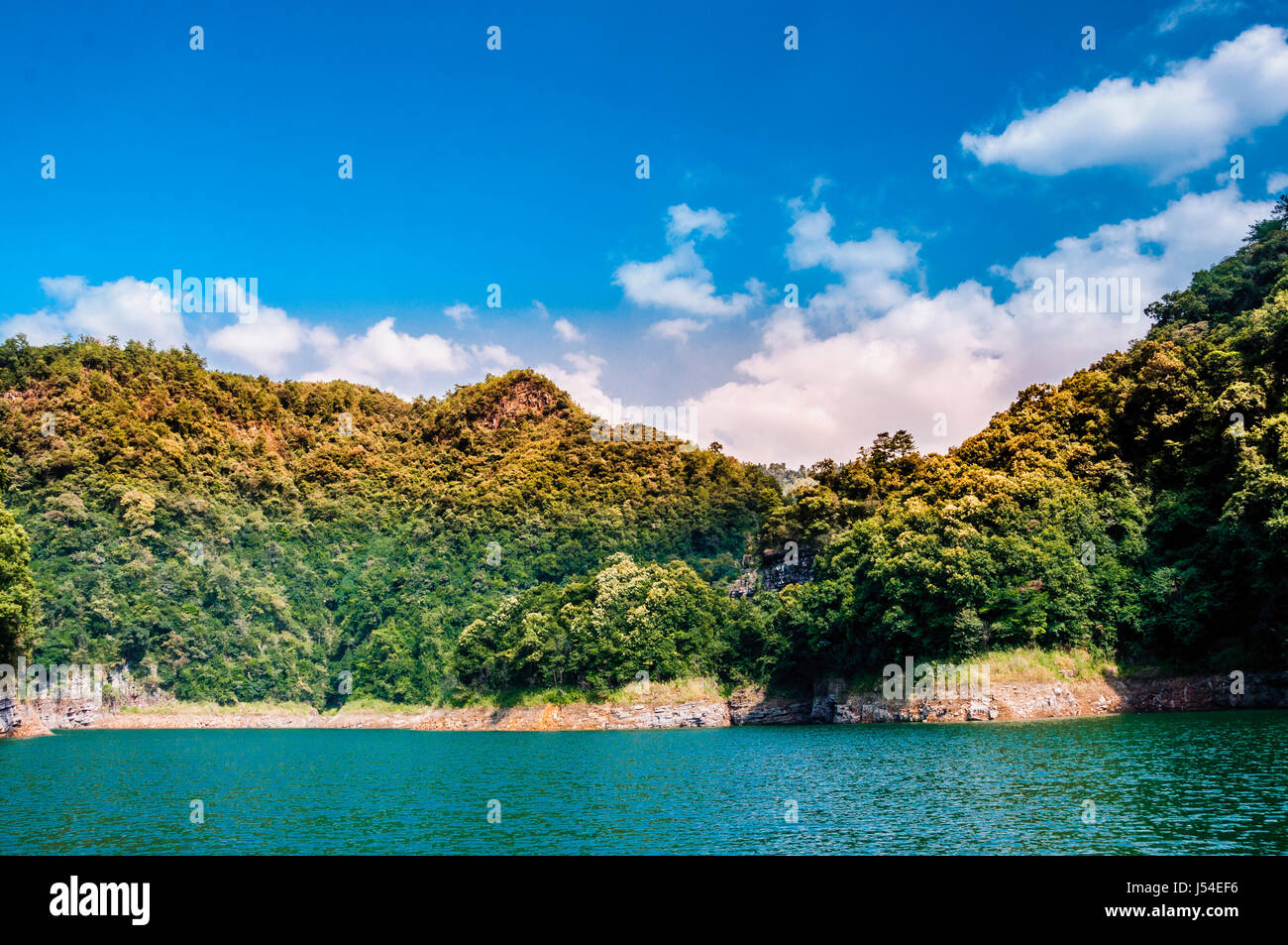 Beautiful reservoir scenery with blue sky in summer Stock Photo - Alamy