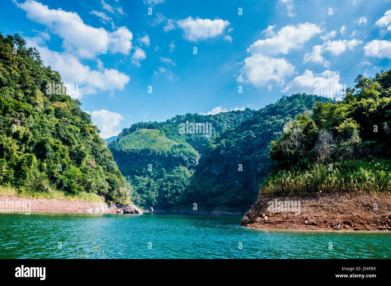 Beautiful reservoir scenery with blue sky in summer Stock Photo - Alamy