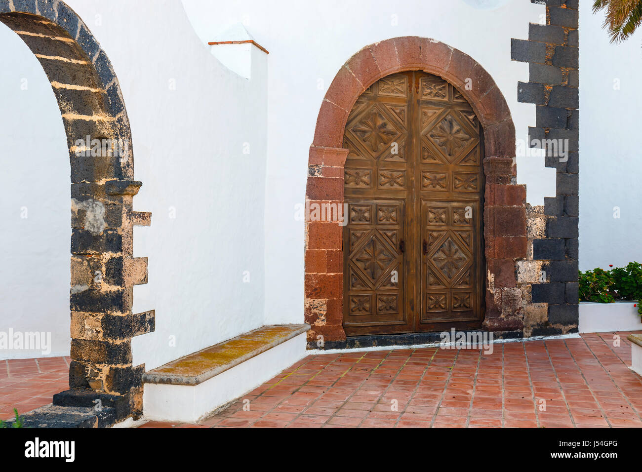 old brown door on white wall background Stock Photo - Alamy
