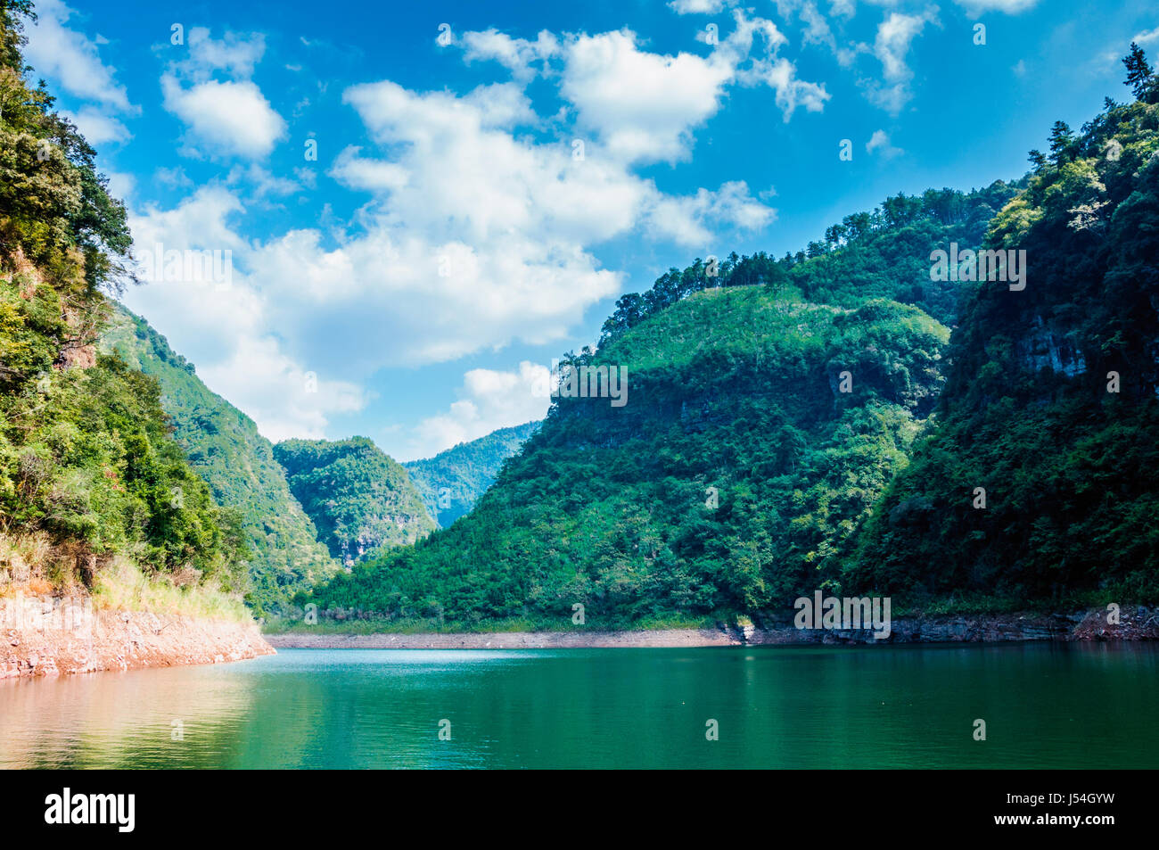 Beautiful reservoir scenery with blue sky in summer Stock Photo - Alamy
