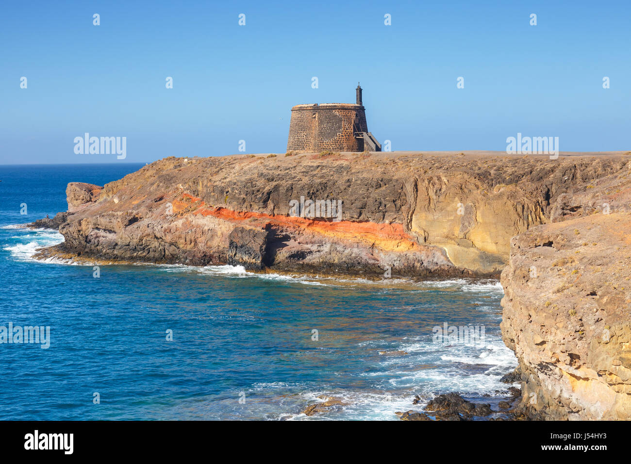 Castle Castillo de las Coloradas on cliff in Playa Blanca, Lanzarote ...