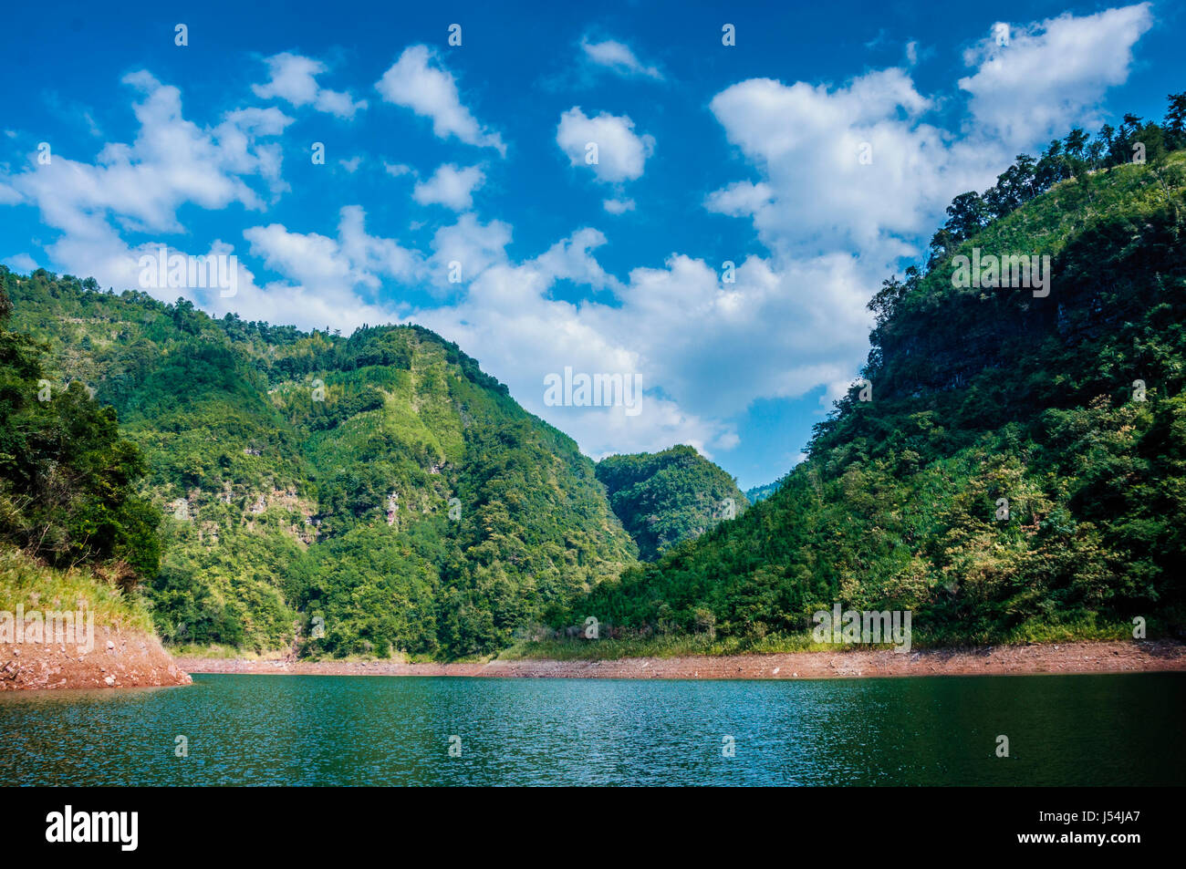 Beautiful reservoir scenery with blue sky in summer Stock Photo - Alamy