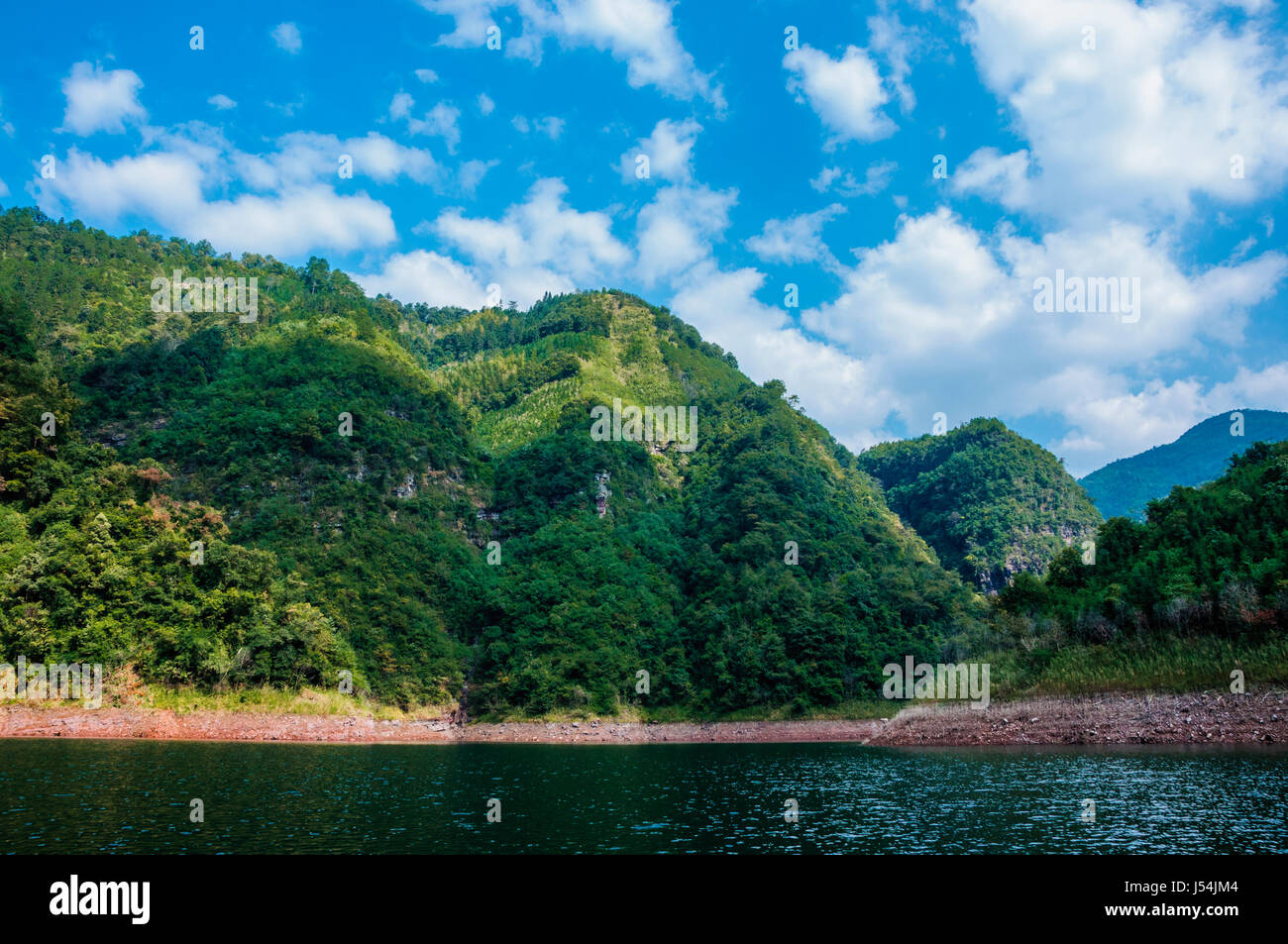 Beautiful reservoir scenery with blue sky in summer Stock Photo - Alamy