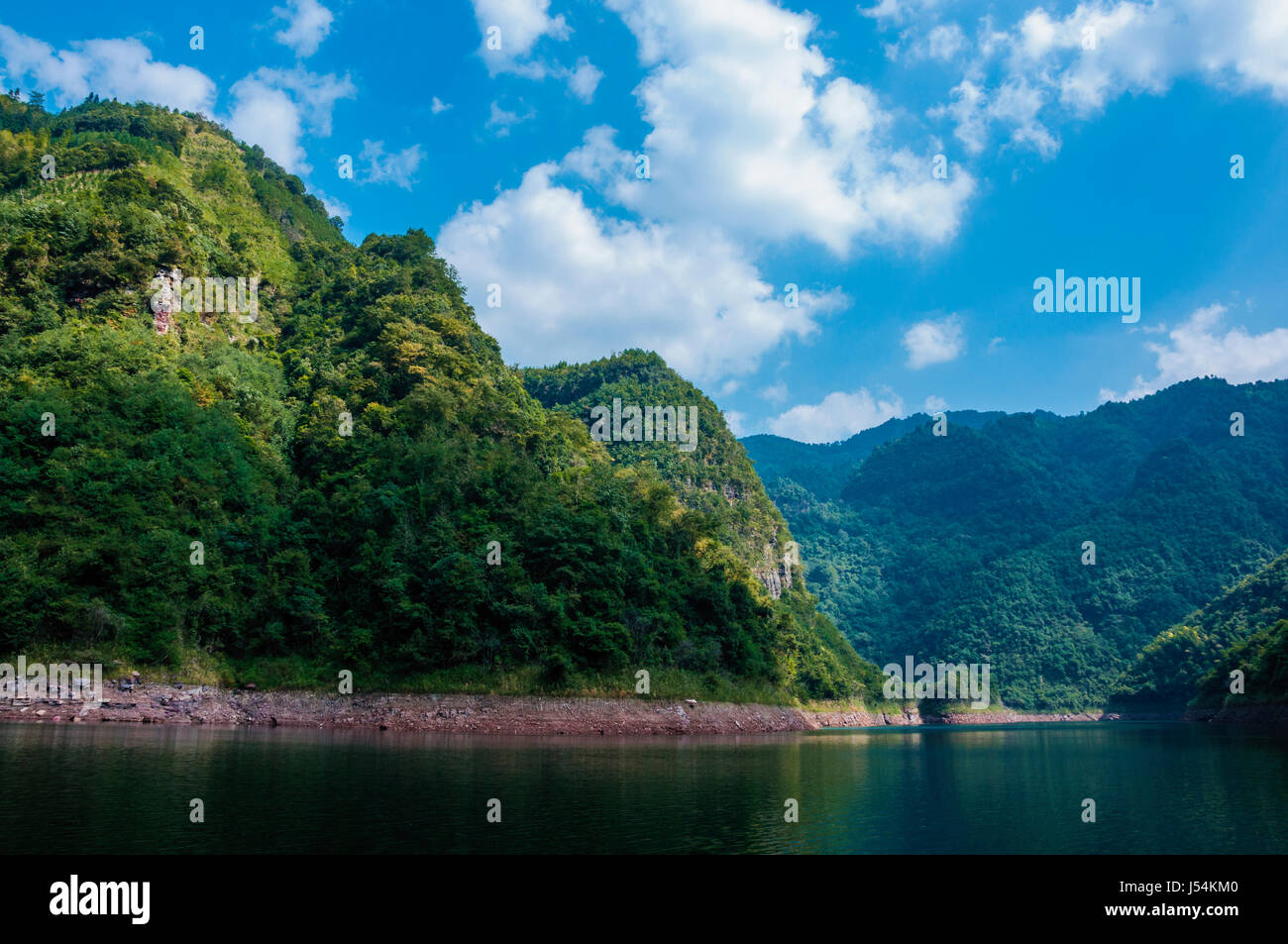 Beautiful reservoir scenery with blue sky in summer Stock Photo - Alamy