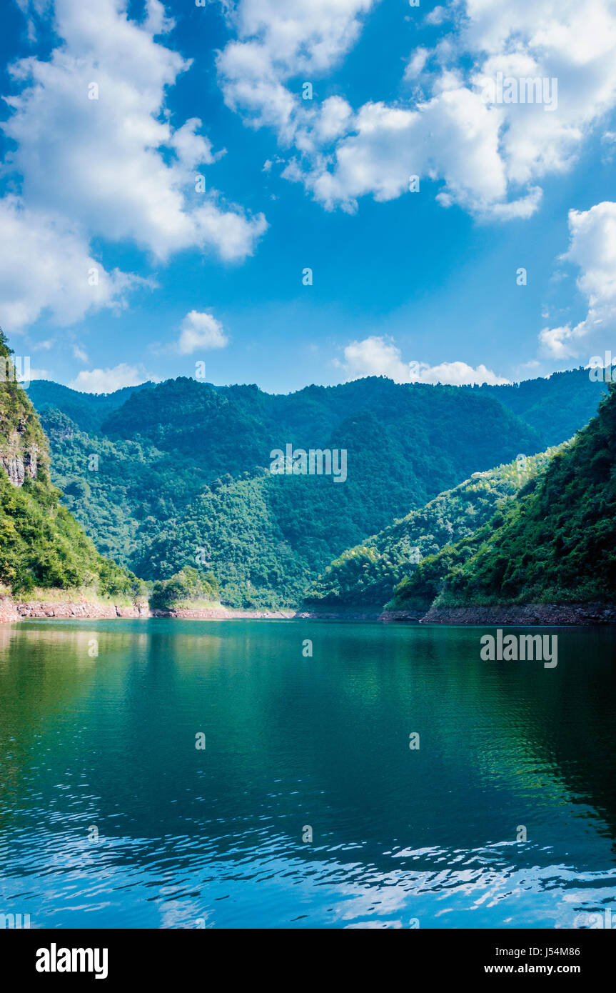 Beautiful reservoir scenery with blue sky in summer Stock Photo - Alamy