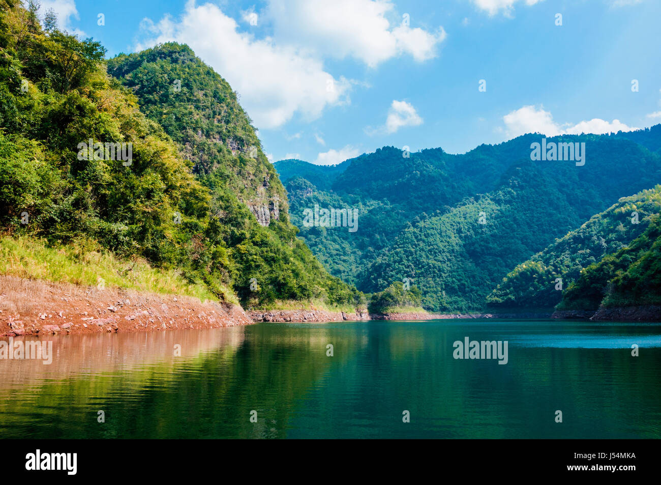 Beautiful reservoir scenery with blue sky in summer Stock Photo - Alamy
