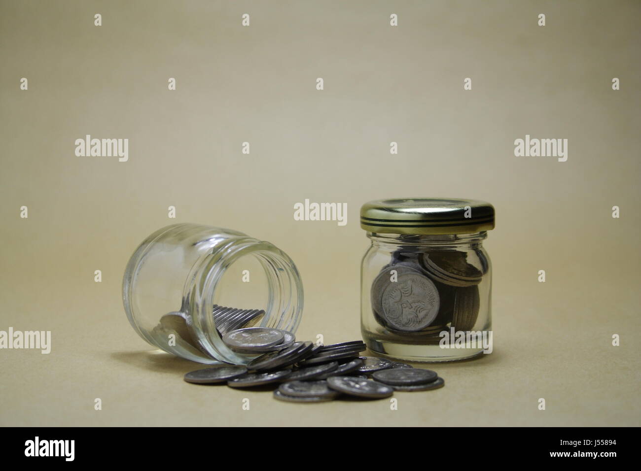 Jars of money hi-res stock photography and images - Alamy