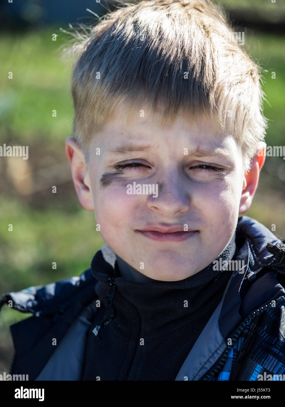 Portrait of a Caucasian boy smeared with soot Stock Photo - Alamy