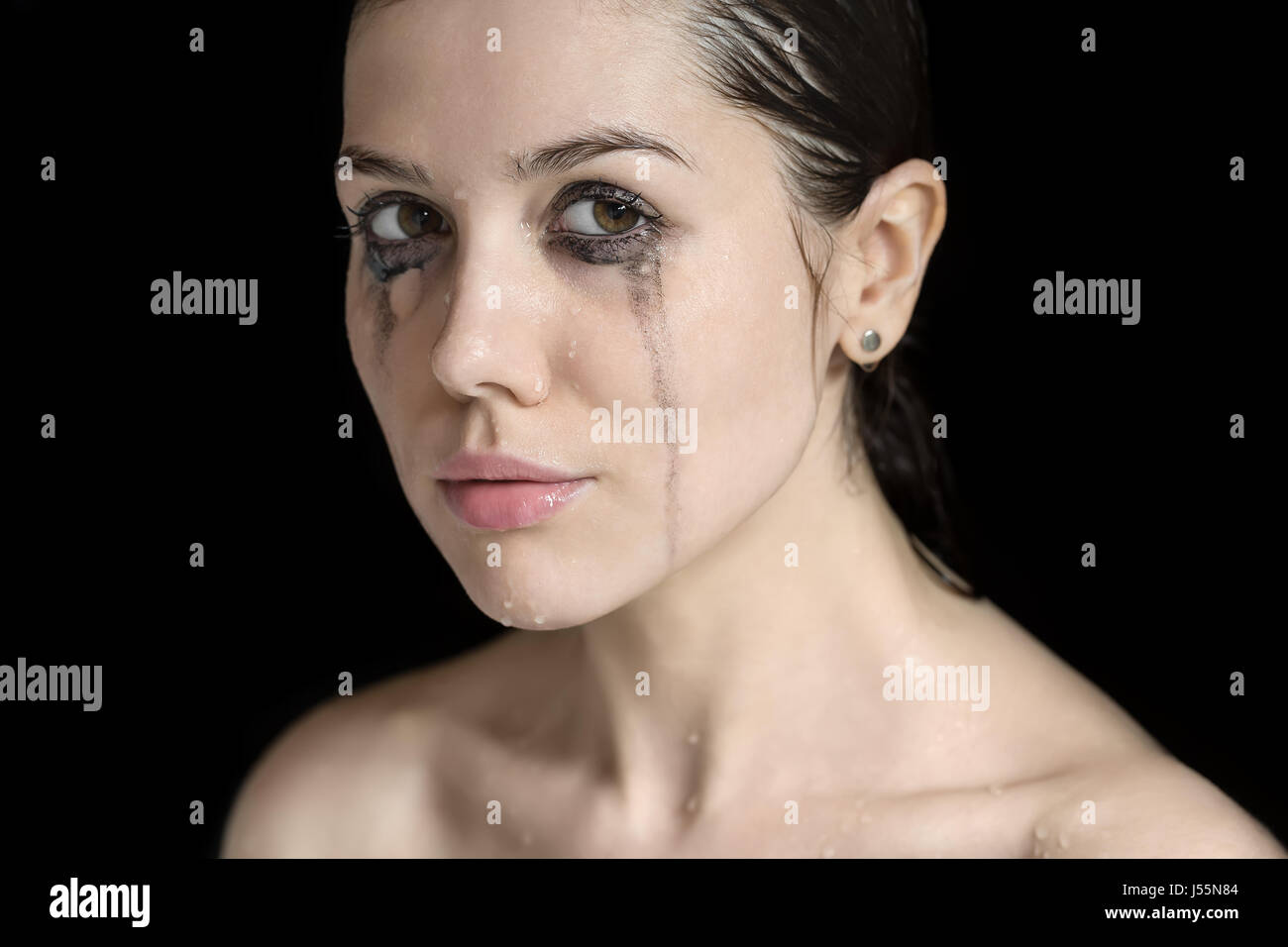Studio portrait of wet woman Stock Photo - Alamy