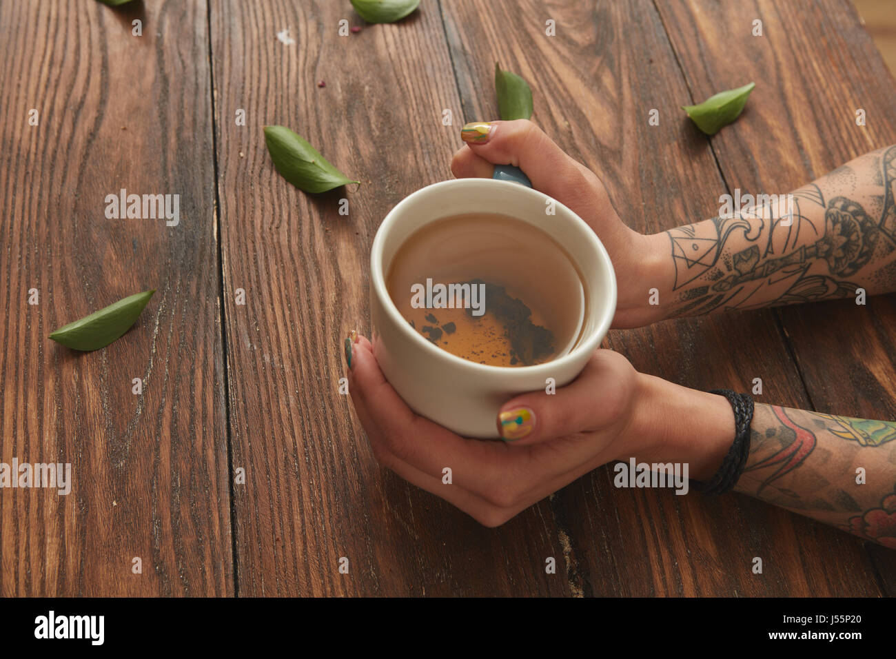 woman holding hot cup of tea Stock Photo - Alamy