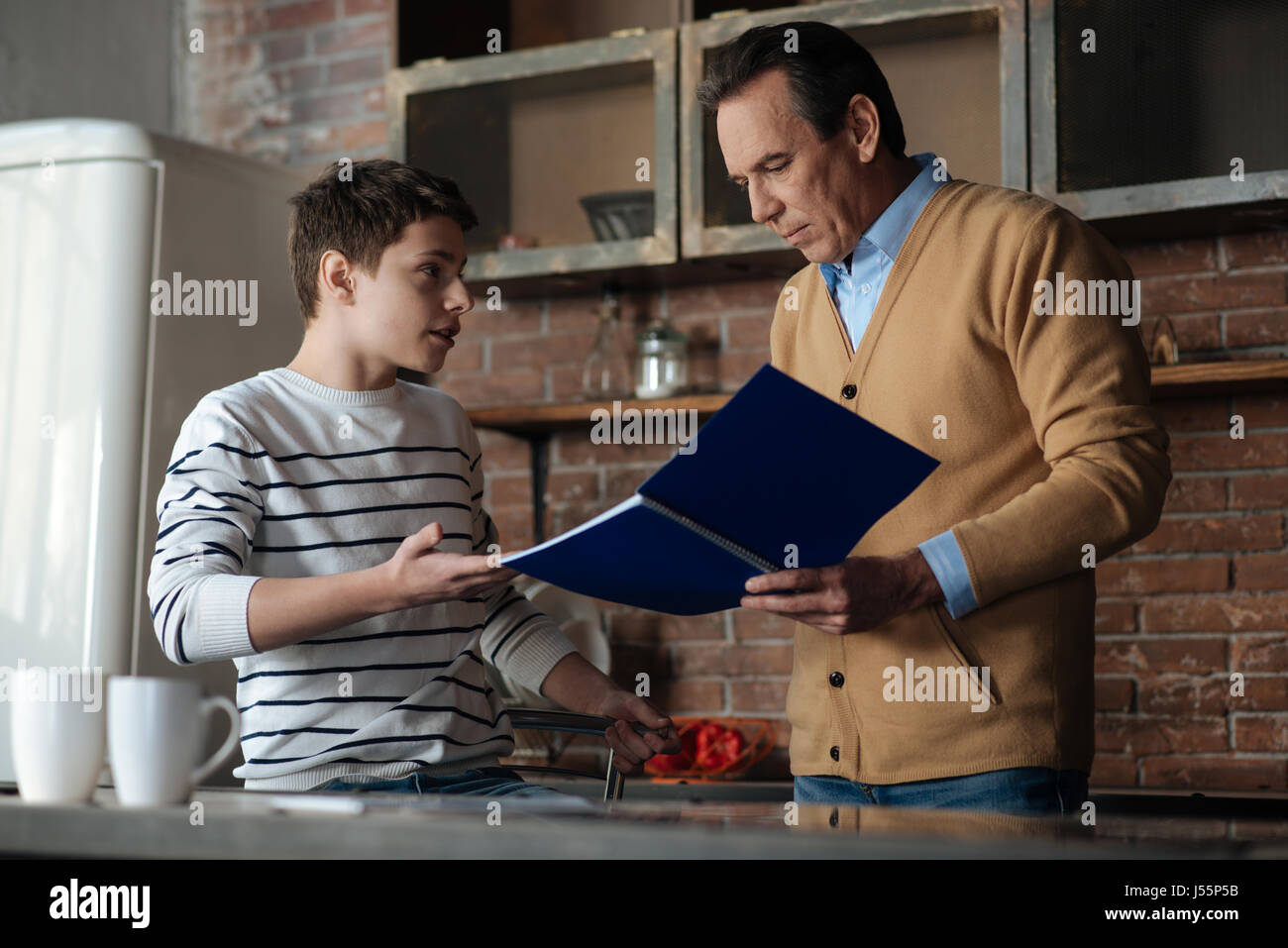 Handsome boy arguing with his father Stock Photo - Alamy