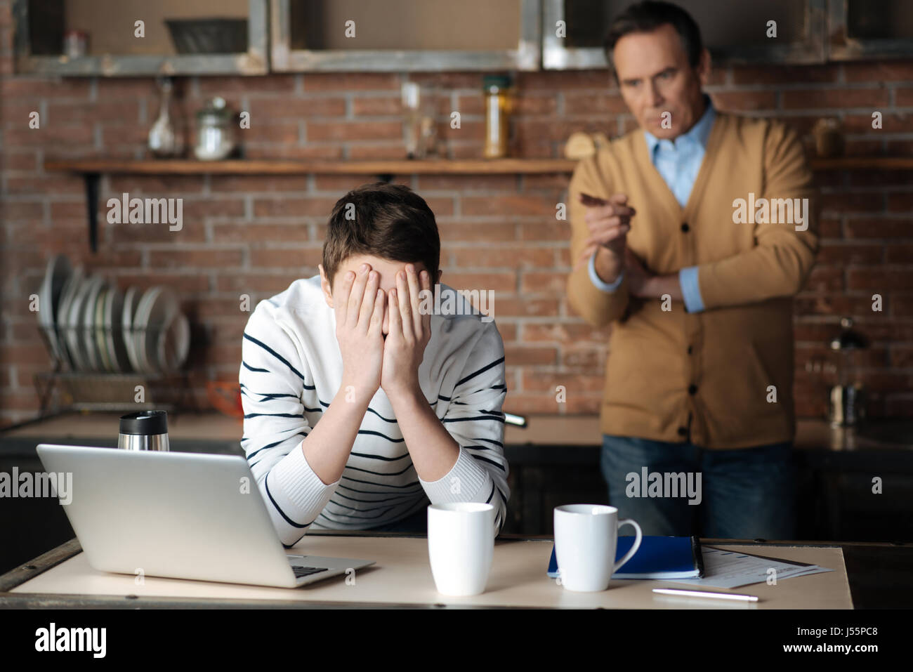 Unhappy boy having some problems in his family Stock Photo - Alamy