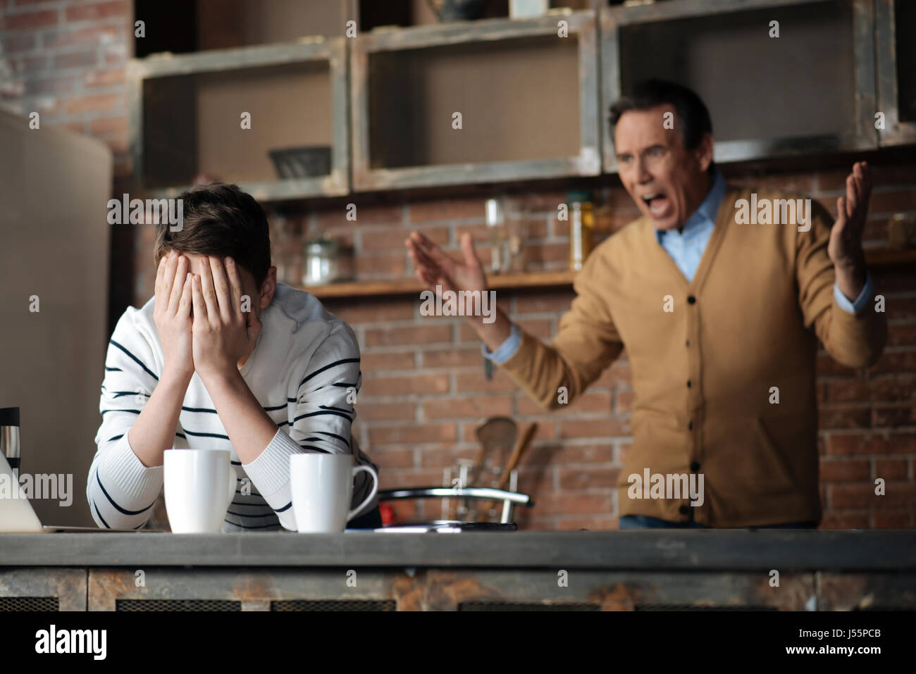 Aggressive father crying at his son Stock Photo - Alamy