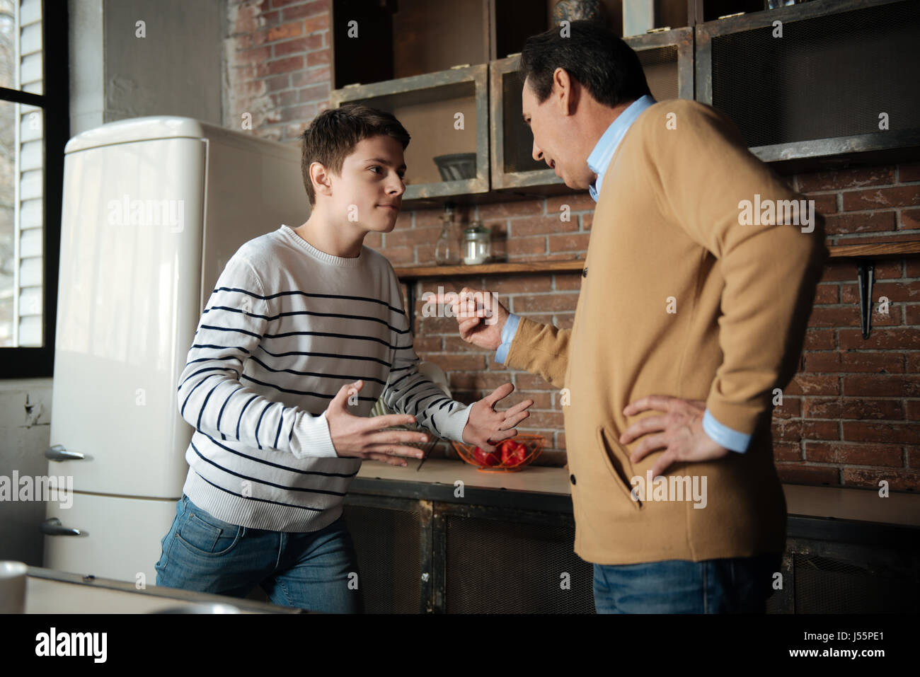 Active man child being ready to attack his father Stock Photo - Alamy
