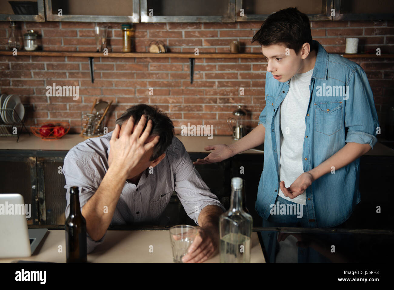 Kind male person suffering from alcoholism Stock Photo - Alamy
