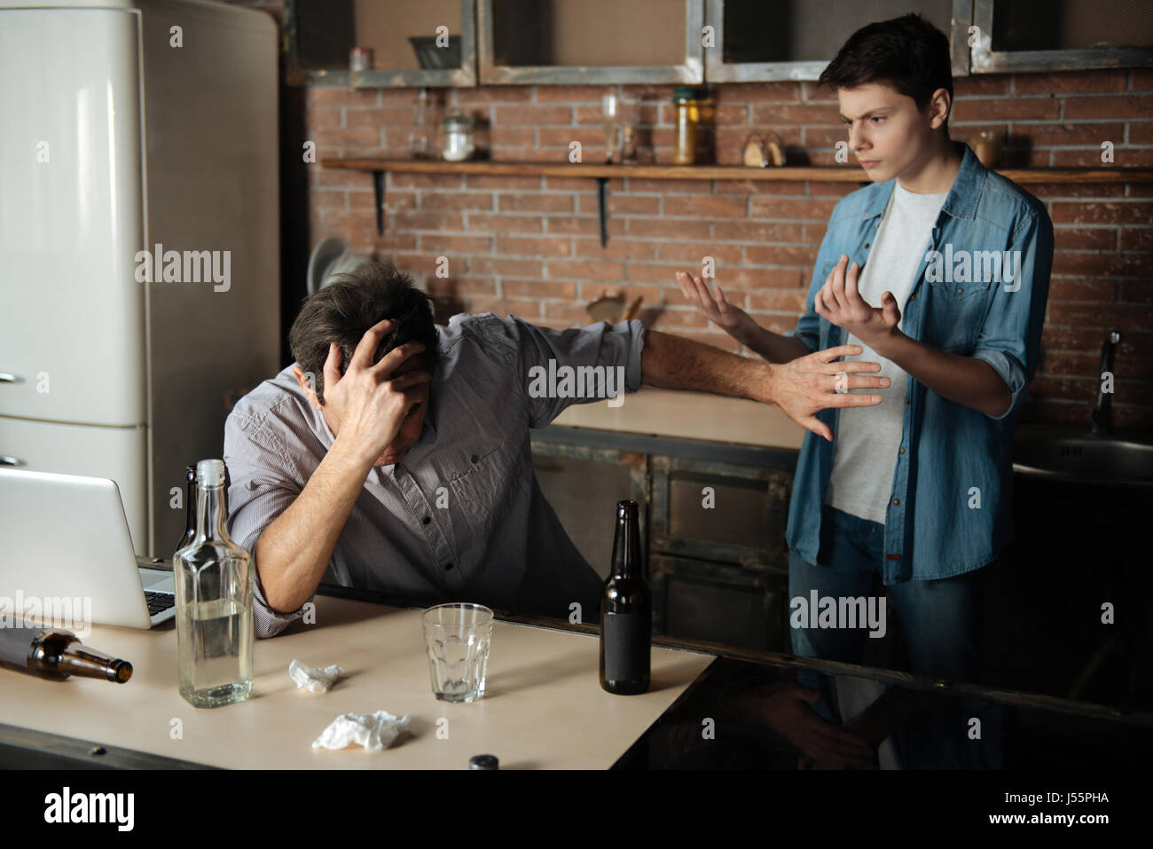 Aggressive teenager raising his hands on daddy Stock Photo - Alamy