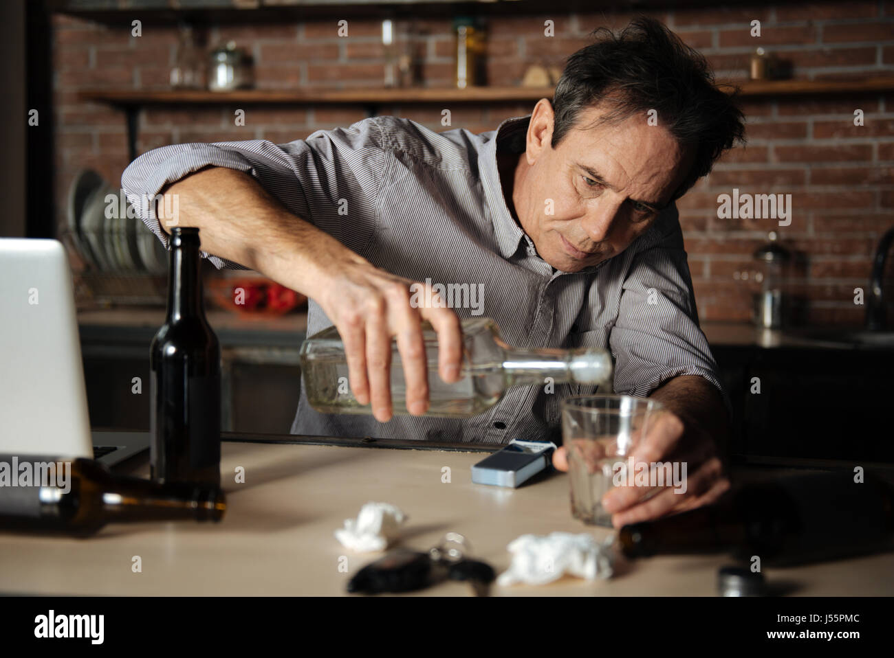 Alcohol addiction man pouring hi-res stock photography and images - Alamy