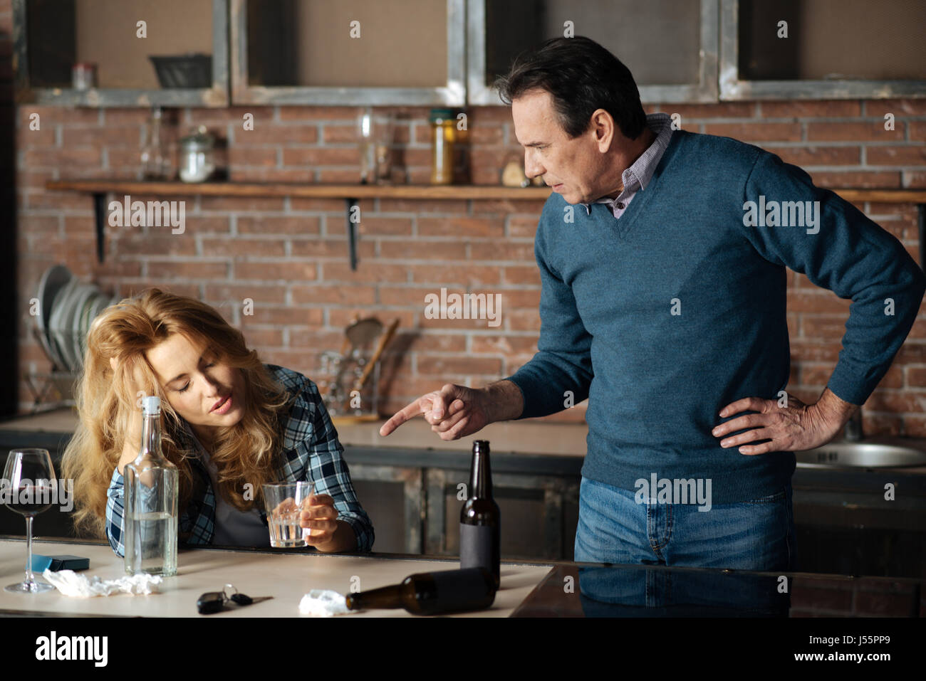 Serious man pointing out the defects Stock Photo - Alamy