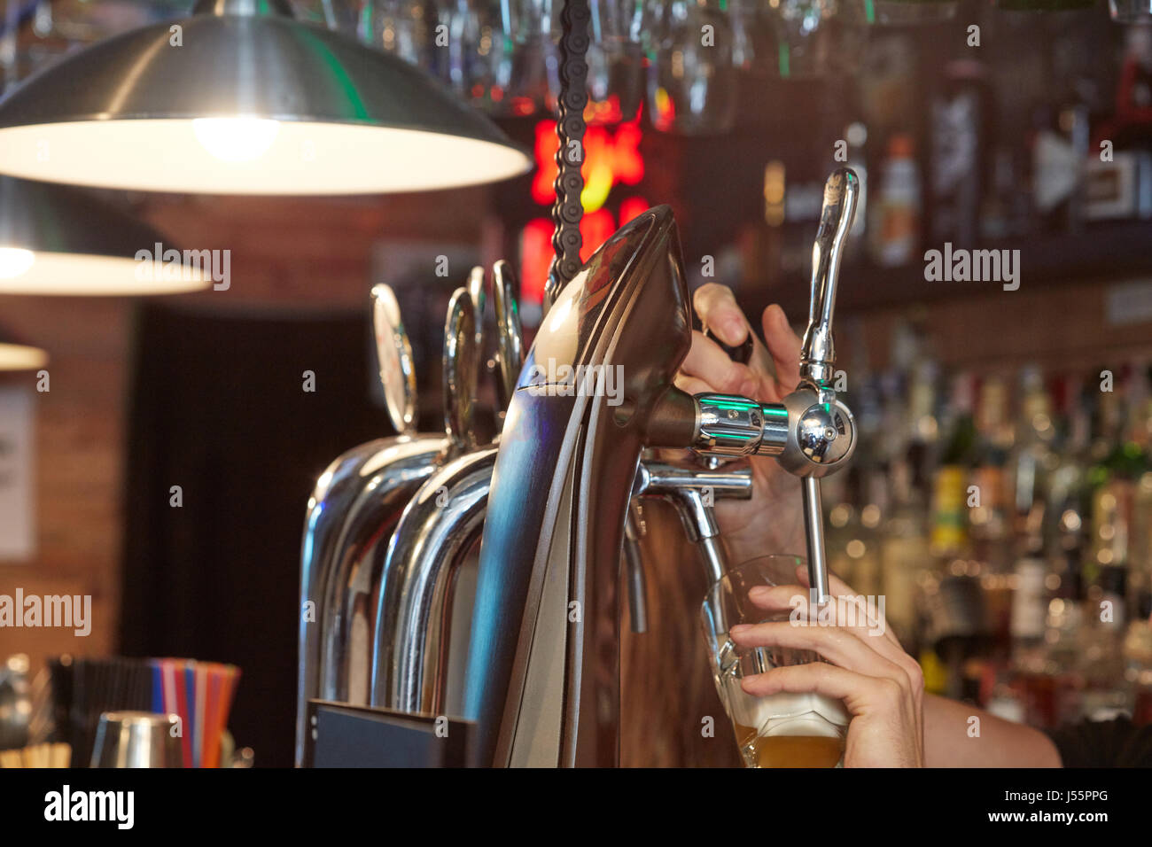 Barman pouring beer Stock Photo - Alamy