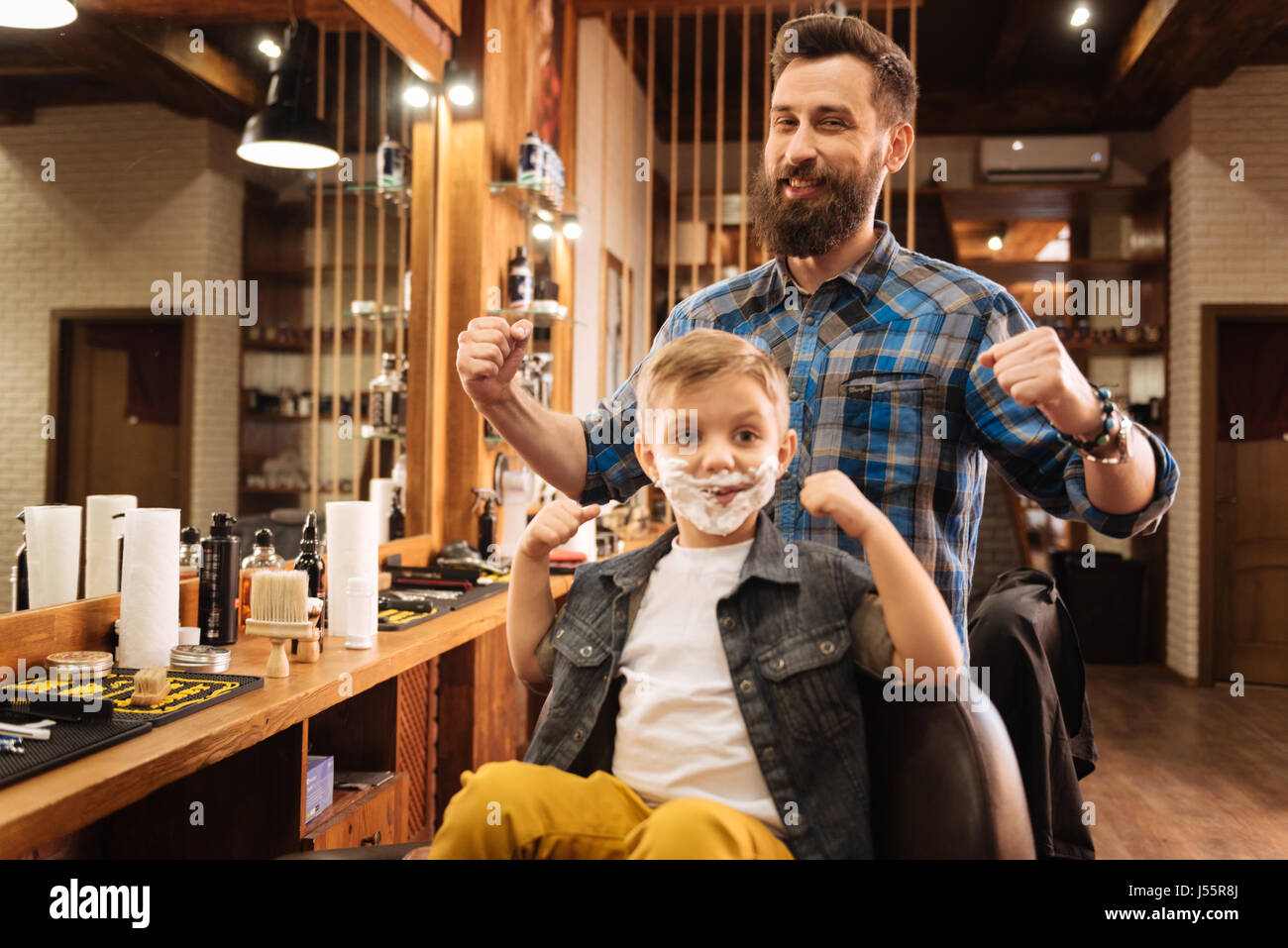 Happy nice boy showing his strength Stock Photo - Alamy
