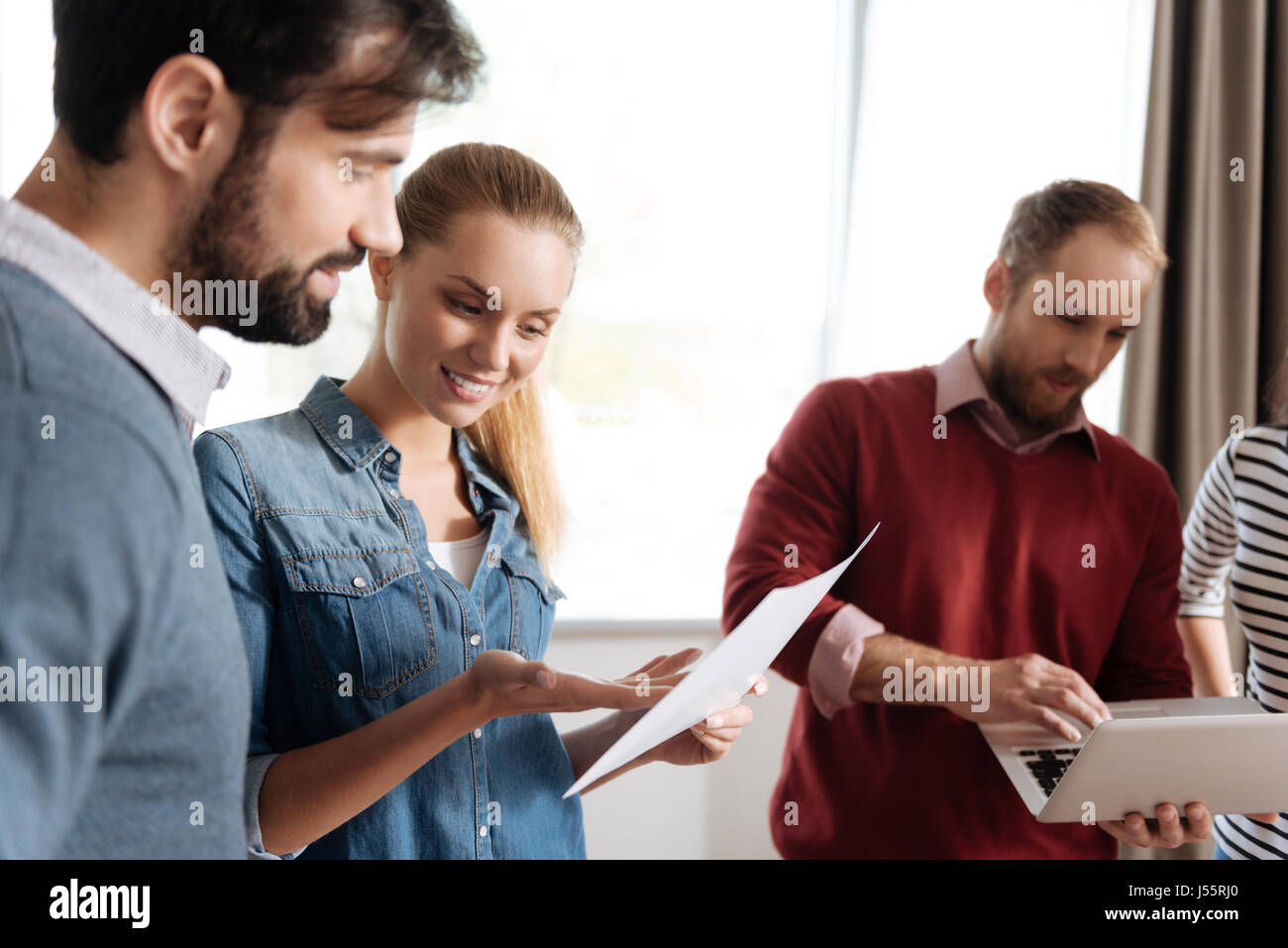 Positive pretty female explaining information to her friend Stock Photo ...